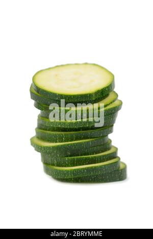 green courgette cut in many slices Stock Photo - Alamy