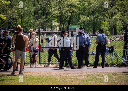 NYPD officers regulate entrance to the Sheep Meadow in Central Park in ...