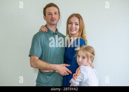 Happy russian father and little daughter posing in domestic interior ...