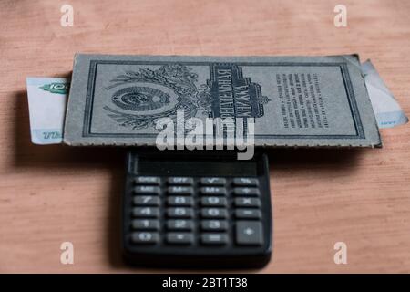 Saving book of Russia with coat of arms, calculator Stock Photo - Alamy
