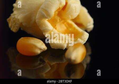 Single popped popcorn on a black background with clipping path Stock ...