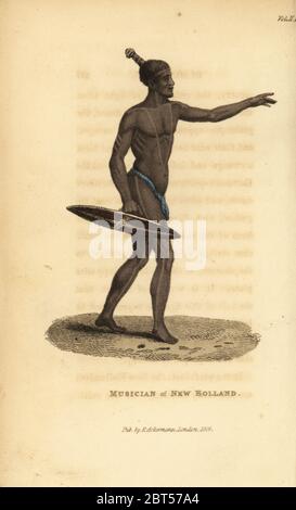 Australian aboriginal dancing at a corroboree. Body painted with pipe ...