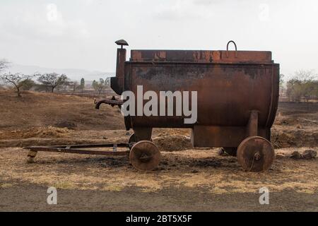 a mobile tar melting furnace with a tank above to melt the tar or ...