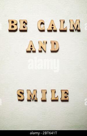 Be calm and smile text in a colored paper Stock Photo - Alamy