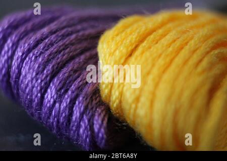 A close up photograph of sewing yarn in multi colours Stock Photo - Alamy