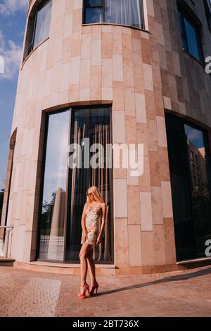 Portrait of a girl in a light summer blue long dress adorned in her ...