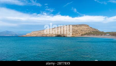 Matala, beautiful beach on Crete island, waves and rocks. Panorama ...