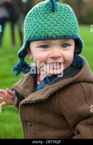 Portrait of baby boy running and smiling outdoor in sunset Stock Photo ...
