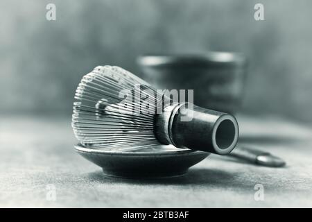 Bamboo tea whisk on rustic stone background. Soft focus. Close up Stock ...