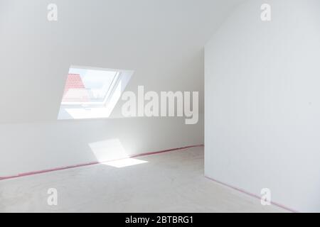 Loft refurbishment - empty room with skylight ready for renovation ...