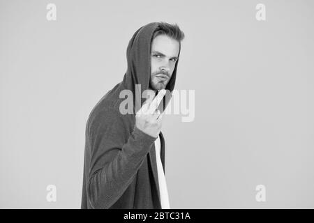 Rude and bad. Rude guy show middle finger yellow background. Rude hand ...