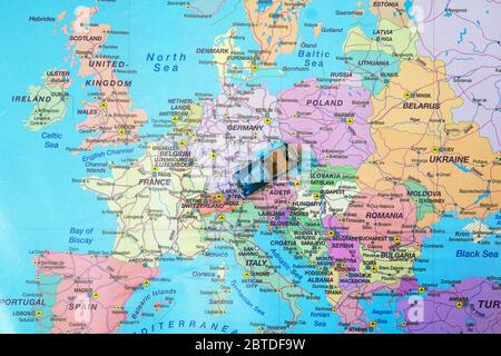 Small toy retro car in the middle of UK map. Travel by car concept ...