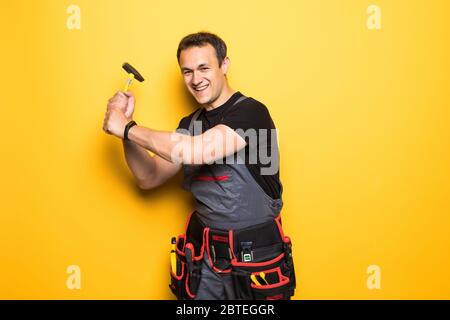 Portrait of repairman raising a hummer and start to work isolated on a ...