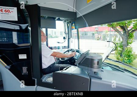 Sinsheim, Germany. 25th May, 2020. A bus driver sits in a bus of the ...