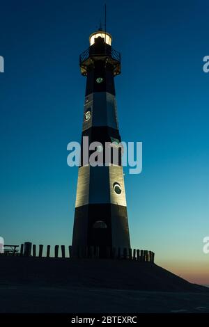 The 'Nieuwe Sluis' lighthouse in Breskens at daytime during summer with ...