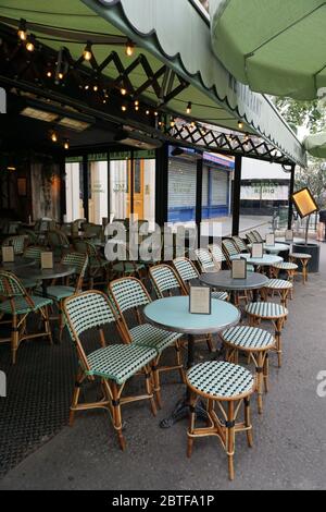 A restaurant cafe with outside seating terrasse in the shade under a ...