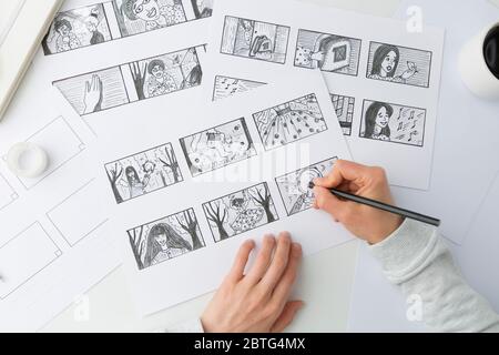 Hands of the artist draw a storyboard on paper. Storytelling. Story ...