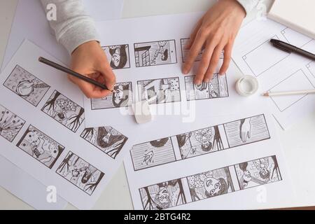 Hands of the artist draw a storyboard on paper. Storytelling. Story ...