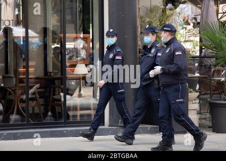 Policemen wearing face masks to protect against coronavirus patrol in ...