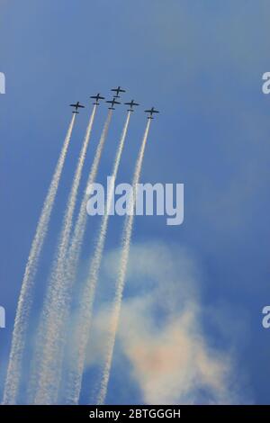 Synchronized teamwork, flying in formations, air show Stock Photo - Alamy