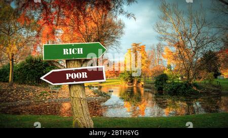 Street Sign the Direction Way to Rich versus Poor Stock Photo - Alamy