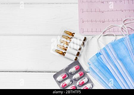 Medical capsules, ampules and face masks close up Stock Photo - Alamy
