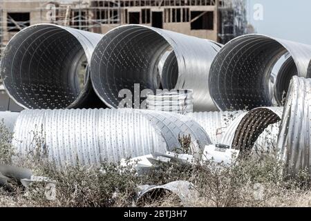 Perforated culvert stacked for use at a construction site in Modesto ...