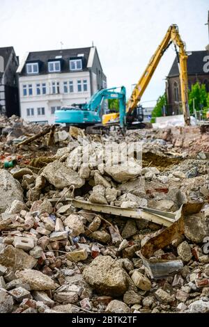 mechanical destruction. Demolition crane dismantling a concrete ...
