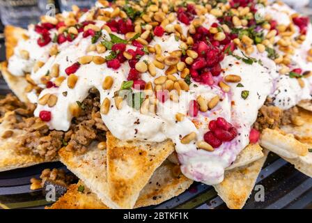 A plate of beef and aubergine fatteh, a traditional middle eastern dish ...