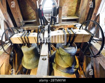 The newly restored church bell of St. Peter is hung back into the tower ...