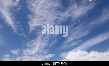 Soft wispy cloud formation against blue sky Stock Photo - Alamy