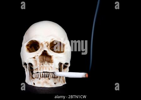 Human skull and smoke on black background Stock Photo - Alamy