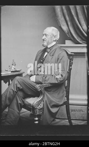 This black-and-white photograph features an unidentified man from 1897 ...