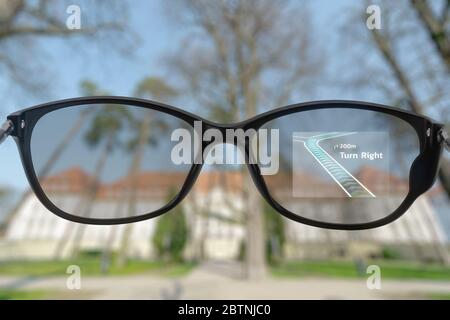 Maps app on smart glasses' lens showcase Stock Photo - Alamy