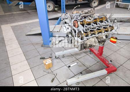 A large V8 car engine with shiny air intake trumpets Stock Photo - Alamy