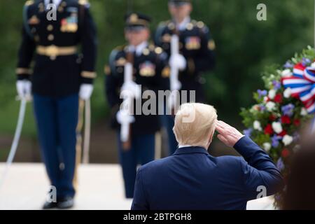 President Donald Trump salutes while on stage in Emancipation Hall at ...