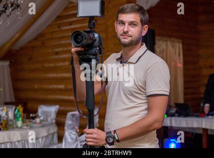 a man with beard camera and a monopod Stock Photo - Alamy