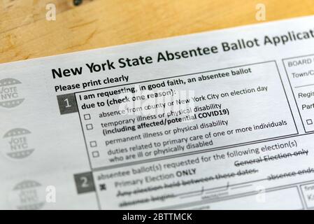 View of a New York State absentee ballot application form on a table ...