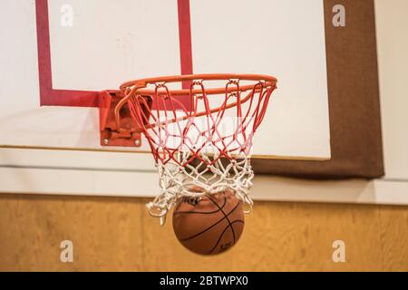 Basketball shot going in net Stock Photo - Alamy