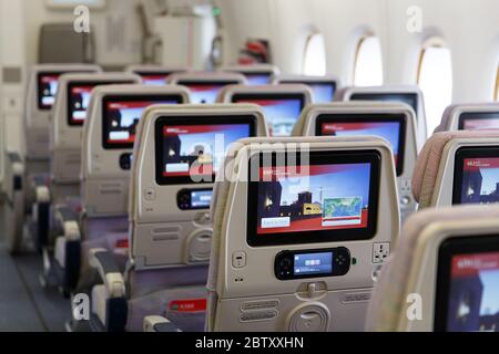 Entertainment system screen inside the cabin of a Emirates Boeing 777 ...