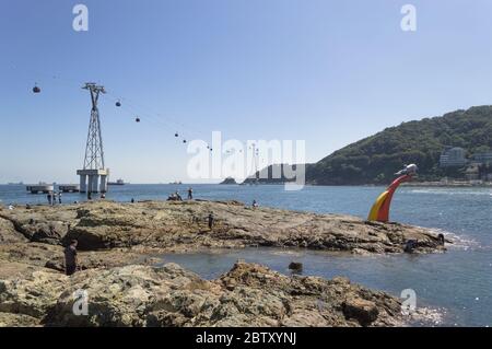 Songdo beach bay in busan, south korea, with urban buildings, green ...