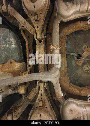 Car wheel bottom view. Garage mechanic raised the car on the lift Stock ...