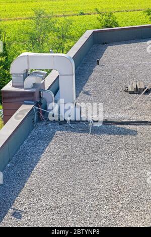 Air Duct Hvac at Gravel Flat Roof Hall Building Stock Photo - Alamy