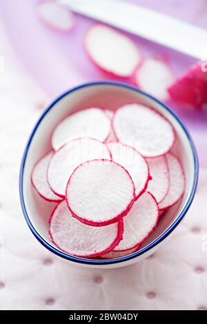 Delicious pink radish in the cut of the dragon's eye variety on a white ...