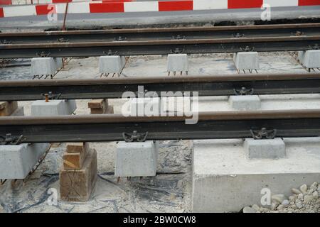 new tram line rails installed in the ground on a concrete base and some ...