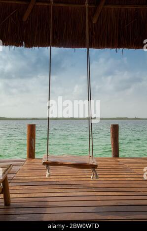 A dock, swing, and a beautiful evening on the lake. Relaxation Stock ...