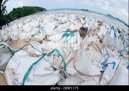 Large sacks or plastic bags put in sand that contains contaminated ...