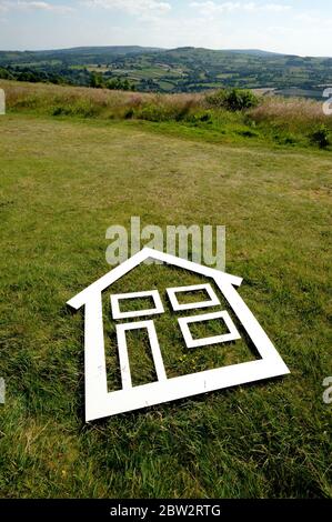 A house shape positioned on a plot of land by a lake Stock Photo - Alamy