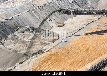 Digging machine busy with deposit of unused soil in Hambach open pit ...