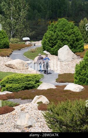 Boxberg, Germany. 29th May, 2020. Visitors sit on a bench in the ...